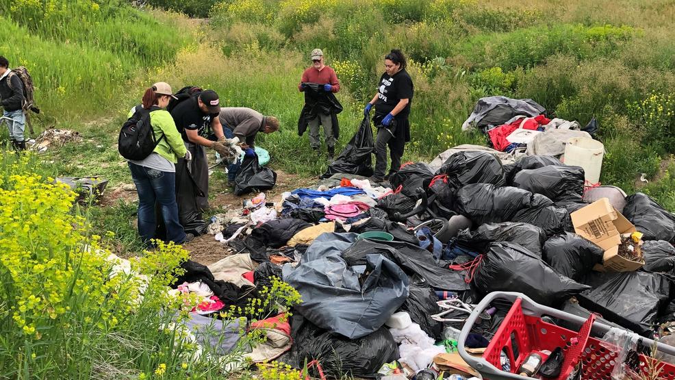 Community groups clean up Missoula homeless encampment | KECI